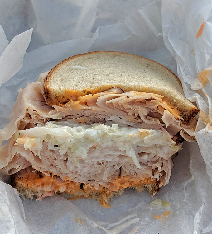 Layer upon layer of thinly sliced turkey creates what can only be described as the skyscraper of deli sandwiches.