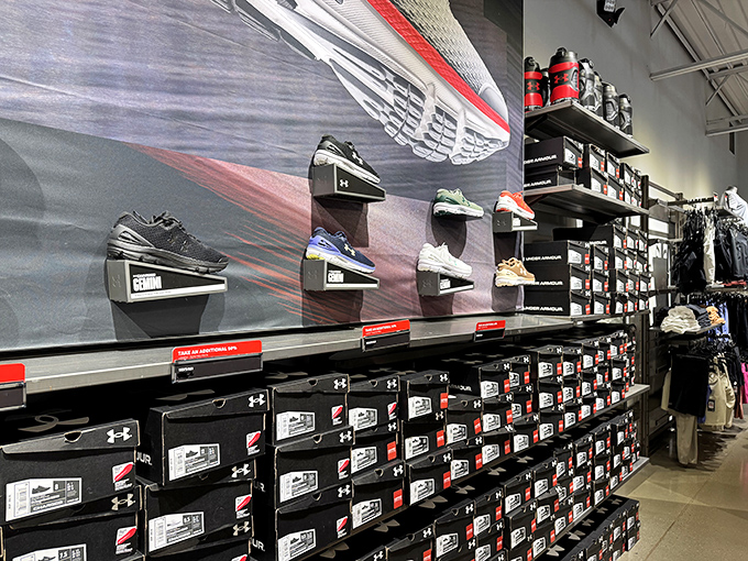 The Under Armour shoe wall &ndash; a monument to human engineering where your feet and wallet can find rare harmony.