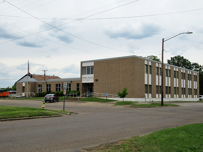 The post office stands as solid as the community it serves, a brick-and-mortar reminder that some institutions remain wonderfully unchanged.