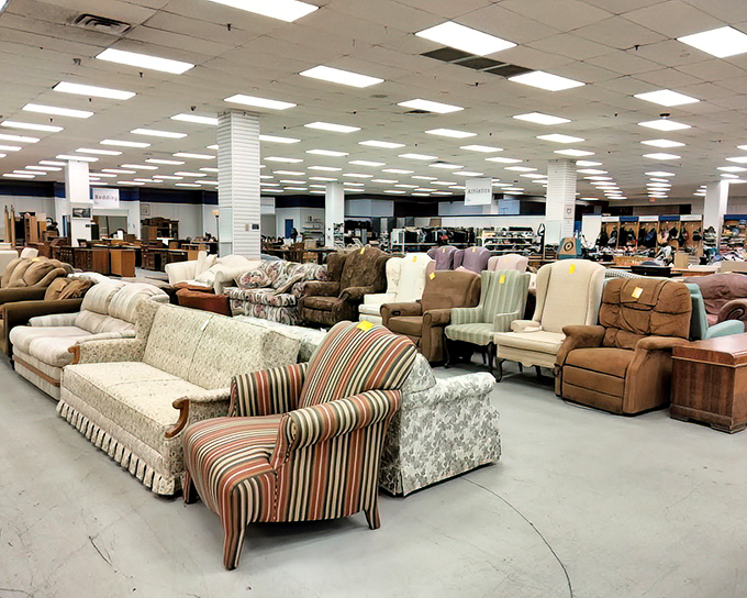 A parliament of sofas and armchairs gathered in silent debate. That striped wingback looks like it has stories to tell from 1972.