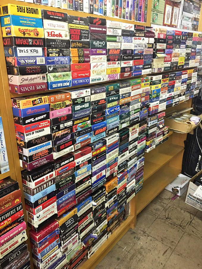 The VHS wall – where "Be Kind, Rewind" isn't just a suggestion, it's a nostalgic trip back to Friday night video store adventures.