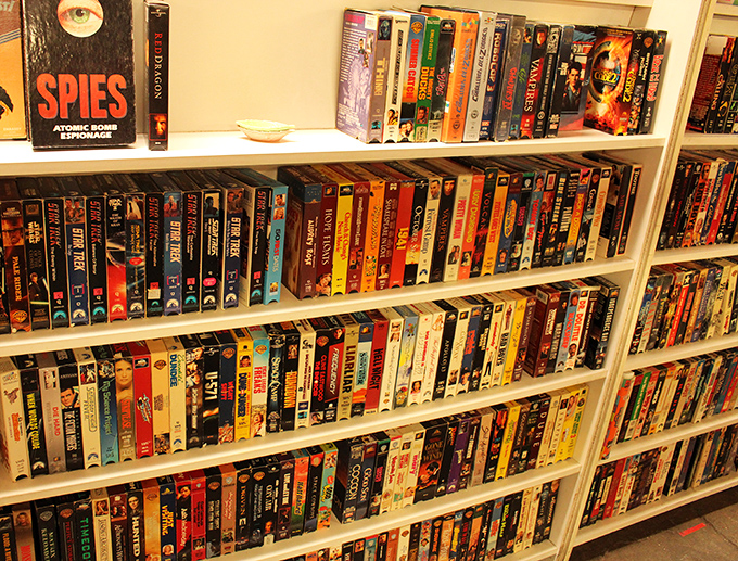 The VHS collection &ndash; where "be kind, rewind" wasn't just a suggestion but a social contract. Blockbuster nights preserved in plastic cases.
