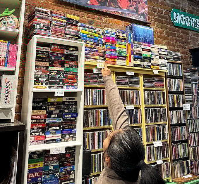 Remember when entertainment required physical media? This wall of nostalgia is like Netflix for archaeologists.