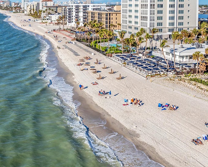 Vanderbilt Beach stretches out like nature's welcome mat, where the Gulf of Mexico meets sugar-white sand that stays cool even when your conversation gets heated.