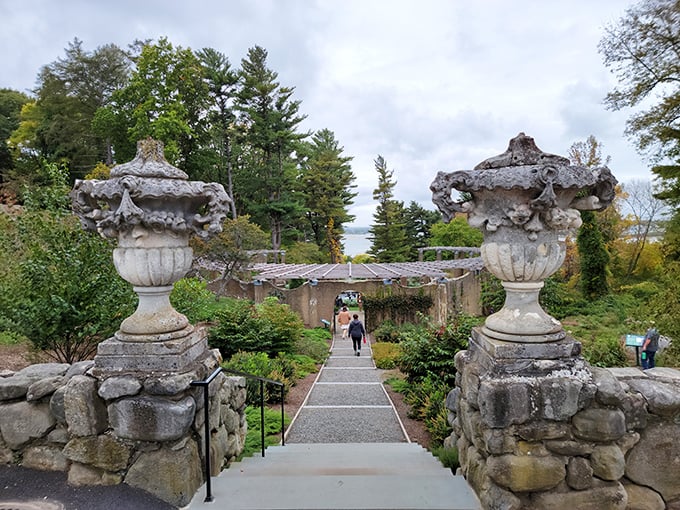Visitors stroll between ornate stone urns that have witnessed more history than most of us will read in a lifetime.