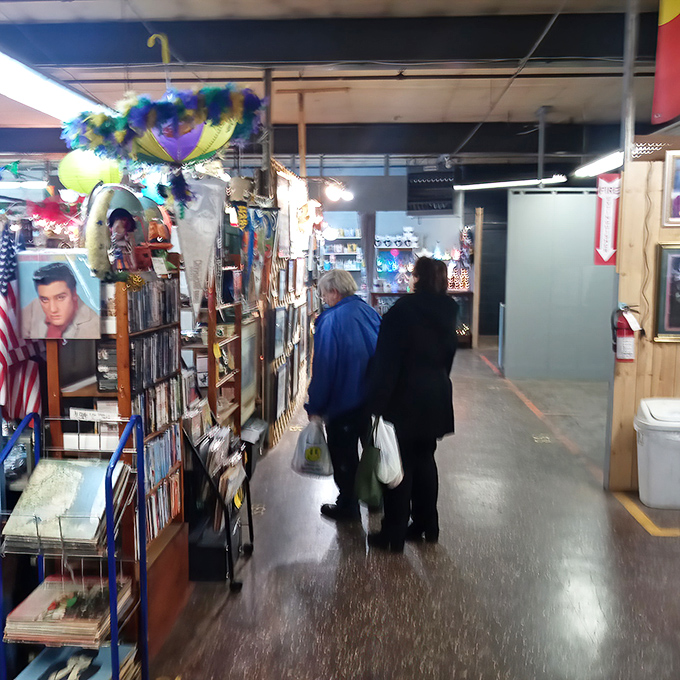 Fellow explorers examine the wares with the focus of archaeologists. Every shopper here knows the thrill of the hunt.