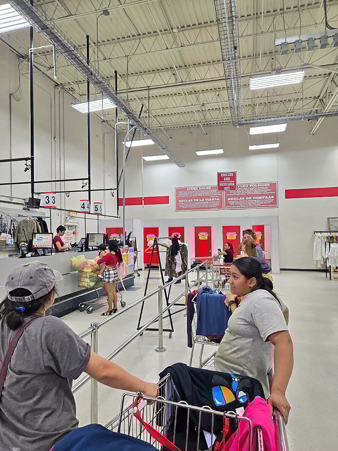 The checkout area buzzes with activity as shoppers prepare to unveil their discoveries to an unsuspecting world.