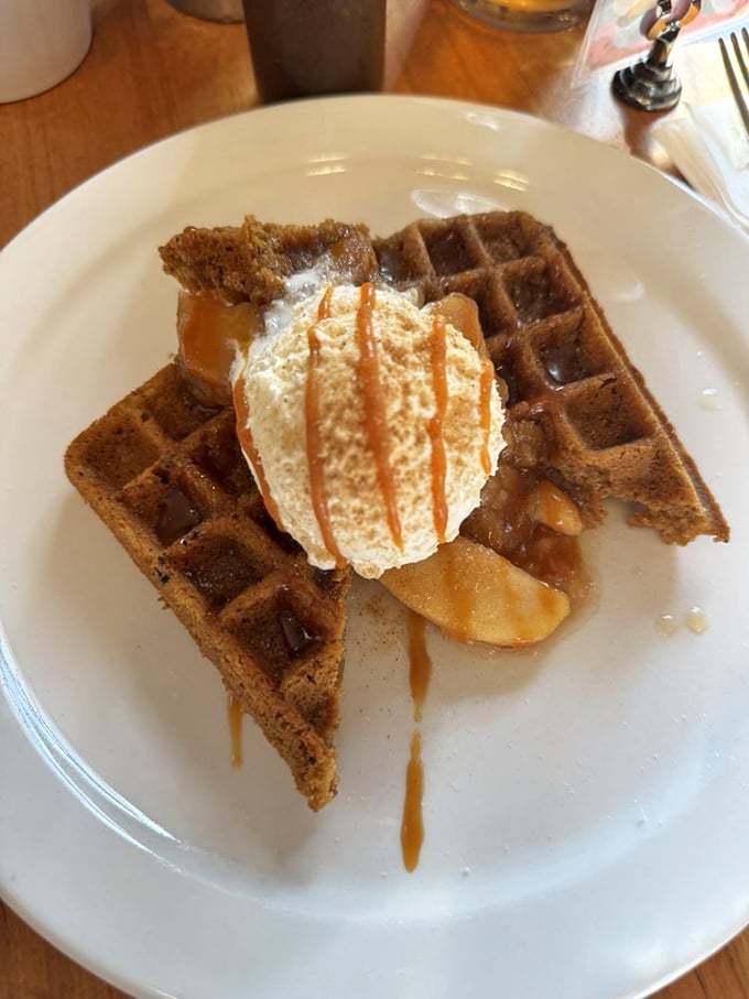 This isn't just any waffle&mdash;it's a cinnamon-spiced canvas topped with caramel drizzle and whipped cream that makes ordinary breakfast seem like a missed opportunity.