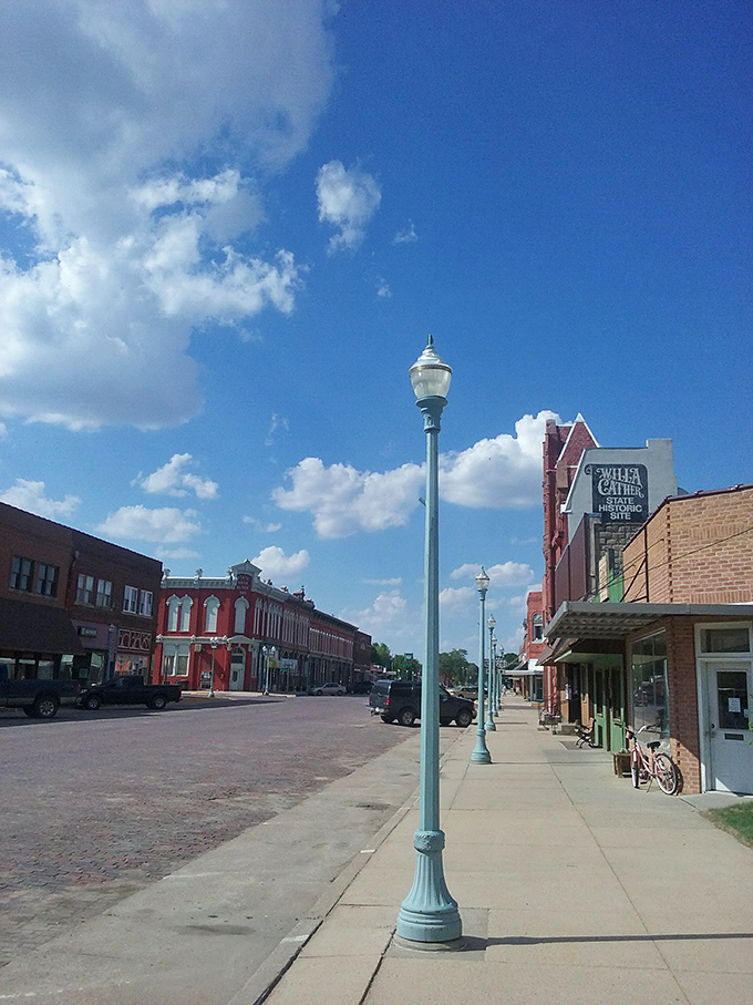 Vintage lampposts line Webster Street, standing guard over brick-paved roads that Willa Cather herself once walked.