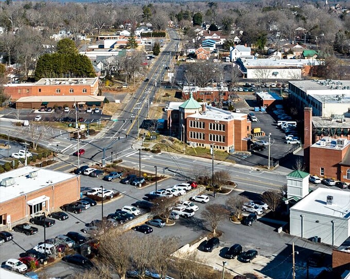 The bird's-eye view of downtown showcases Morganton's impressive architectural heritage, with the historic courthouse standing proud among brick buildings.