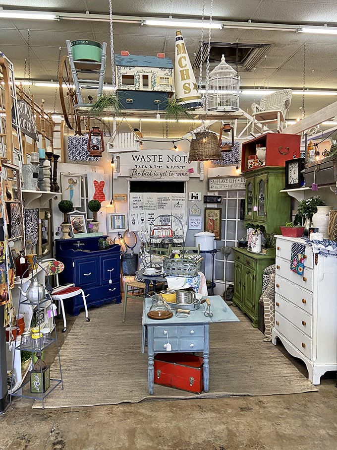 Suspended birdcages, weathered furniture, and that "WASTE NOT" sign&mdash;this booth feels like your stylish grandmother and Joanna Gaines collaborated.