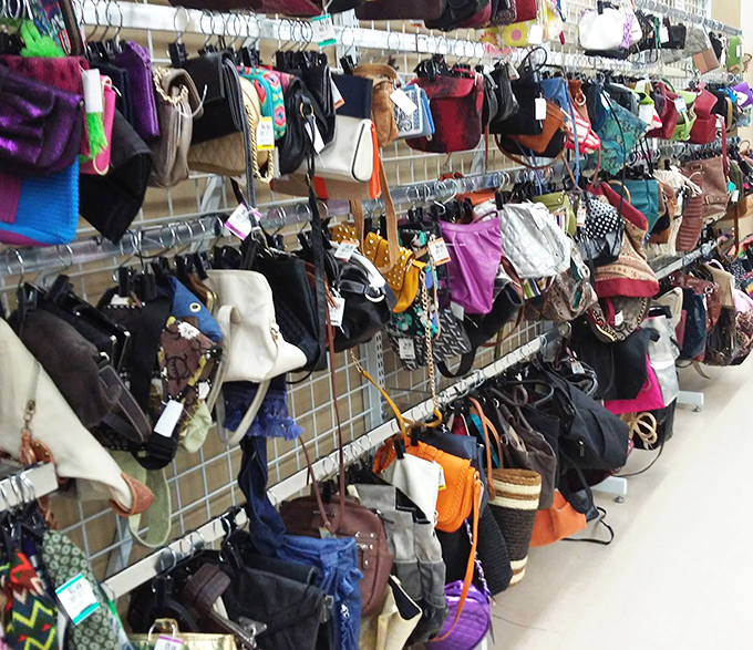 Handbag heaven or purse purgatory? Depends on your patience for treasure hunting. Each bag represents someone's former fashion statement waiting for its second act.