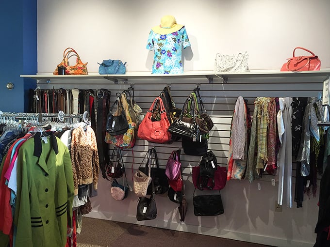 Handbag heaven! Designer purses and everyday totes hang in colorful rows, each with stories from previous lives waiting to be continued.