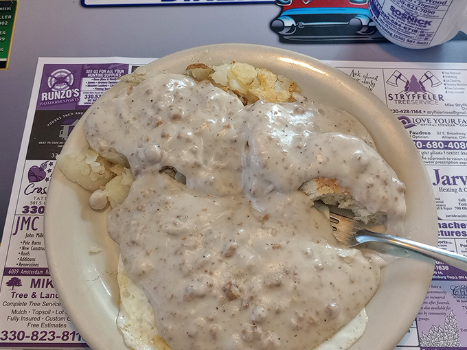 Behold the holy grail of diner cuisine&mdash;biscuits swimming in a sea of peppery sausage gravy. Not diet food, but absolutely worth the extra mile on tomorrow's walk. 
