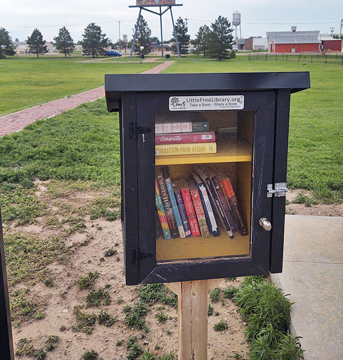 A Little Free Library stands sentinel near the giant easel&mdash;because one form of culture deserves another. Take a book, leave a book, contemplate art.