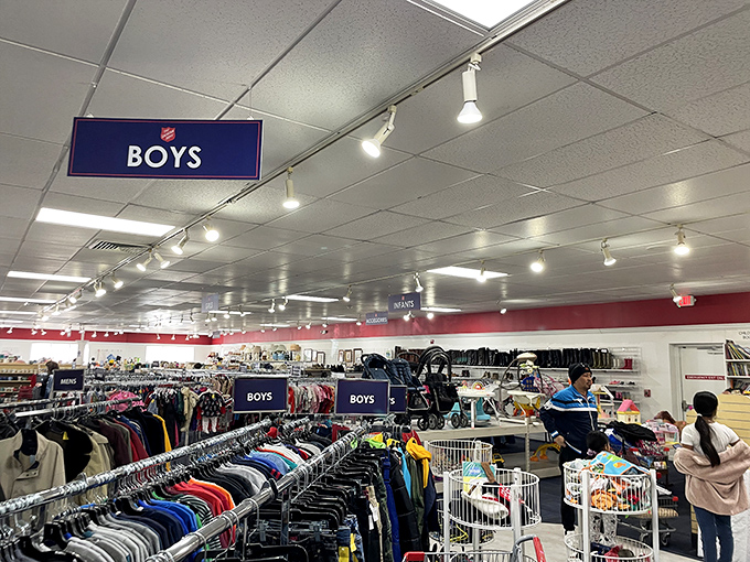 The boys' section: where tomorrow's memories are priced for today's allowances. Blue signs guide parents and grandparents to kid-approved fashion finds.