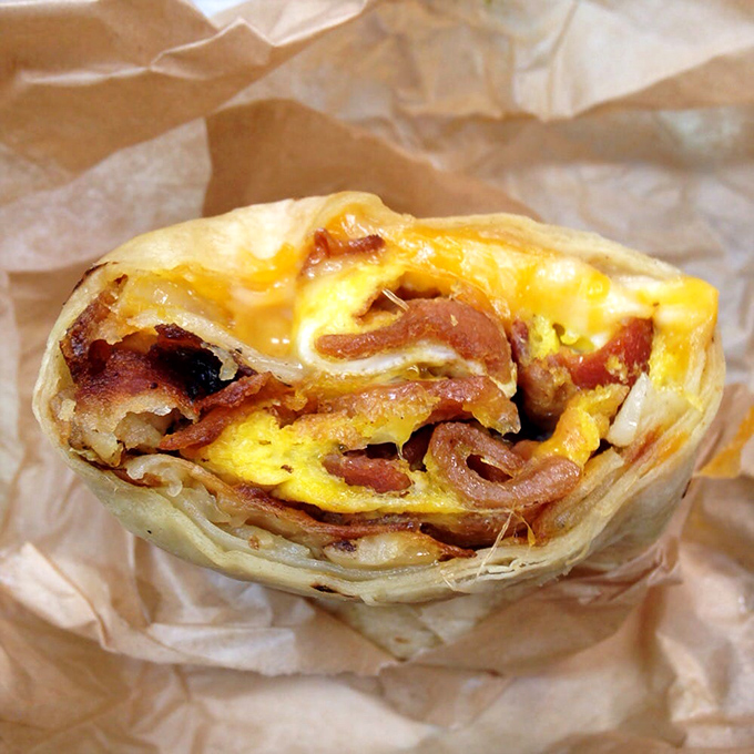 Breakfast burrito perfection: where eggs, bacon and cheese perform a morning symphony in tortilla-wrapped harmony. Worth setting an alarm for.