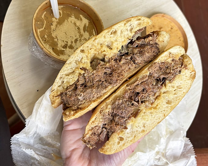 Brisket so tender it practically surrenders to gravity. The au jus cup isn't optional&mdash;it's the difference between a good day and a great one. 
