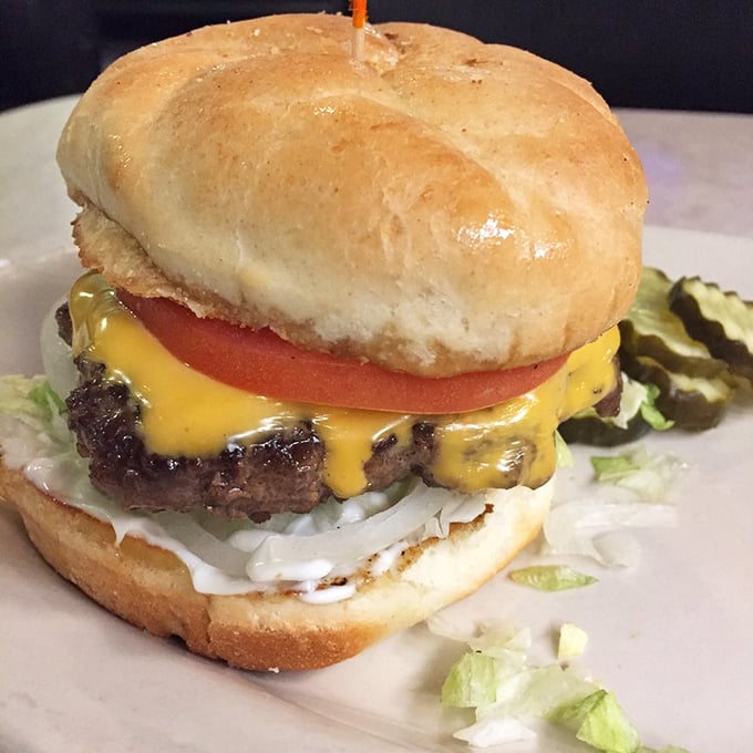 This isn't just a burger; it's a masterclass in proper cheese-to-meat ratio. That melty American cheese drape should win design awards.