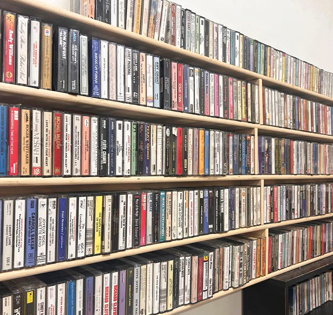 A time capsule of cassette tapes lines the shelves, each one a nostalgic portal to road trips and mixtapes of decades past.