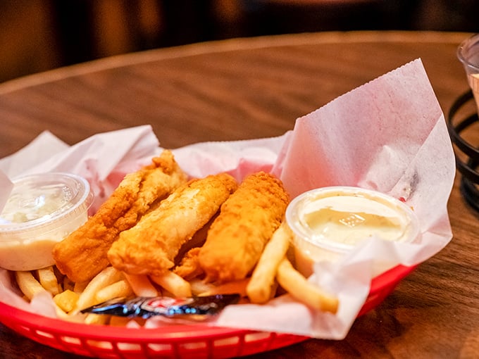 Golden-battered fish that crunches like autumn leaves, paired with fries that could make a Frenchman weep with joy.