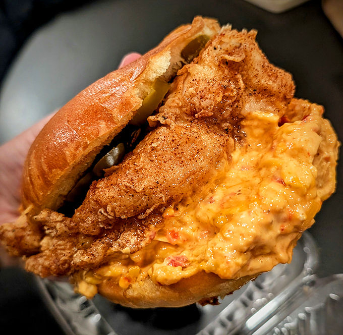 This sandwich doesn't just speak to you, it serenades&mdash;golden-fried chicken nestled in a potato roll with pimento cheese that's worth crossing state lines for.