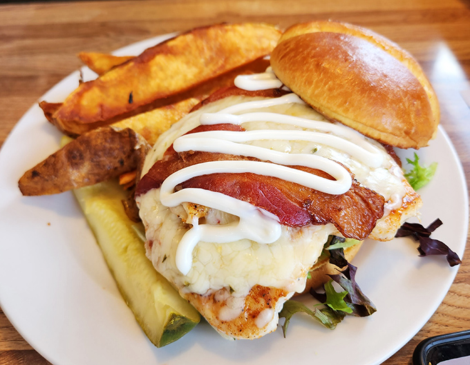 This isn't just a sandwich; it's architecture &ndash; layers of chicken, bacon and cheese creating a savory skyscraper that demands to be photographed before demolished.