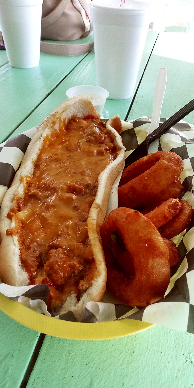 The legendary chili dog with a side of hand-breaded onion rings &ndash; a Sno-Cap classic served on their signature checkered paper.