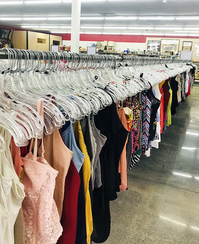 The cookware section&mdash;where cast iron pans with decades of seasoning wisdom wait for new kitchens to conquer and meals to transform.