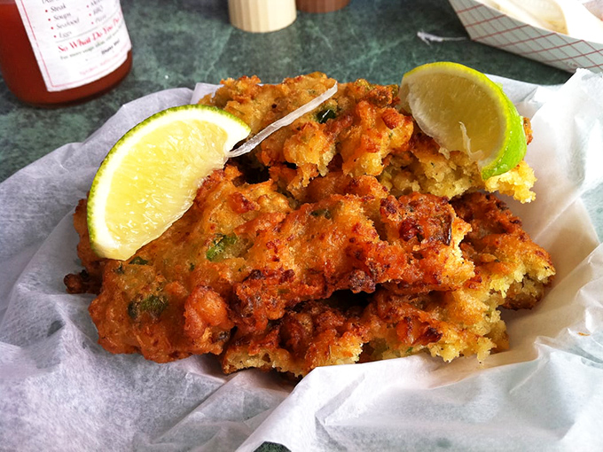 These conch fritters aren't just fried &ndash; they're little golden orbs of Keys history. The lime wedge isn't a suggestion, it's an essential flavor companion.