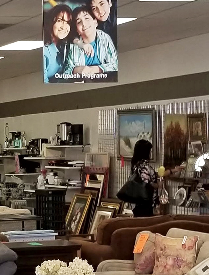 Weekend warriors of thrift navigate the furniture maze, each on their own quest for that perfect conversation piece.
