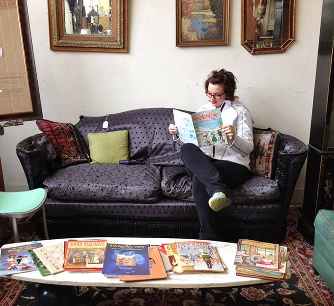 The perfect antique shopping experience: discovering vintage books on a vintage couch that's probably witnessed more history than the books themselves.