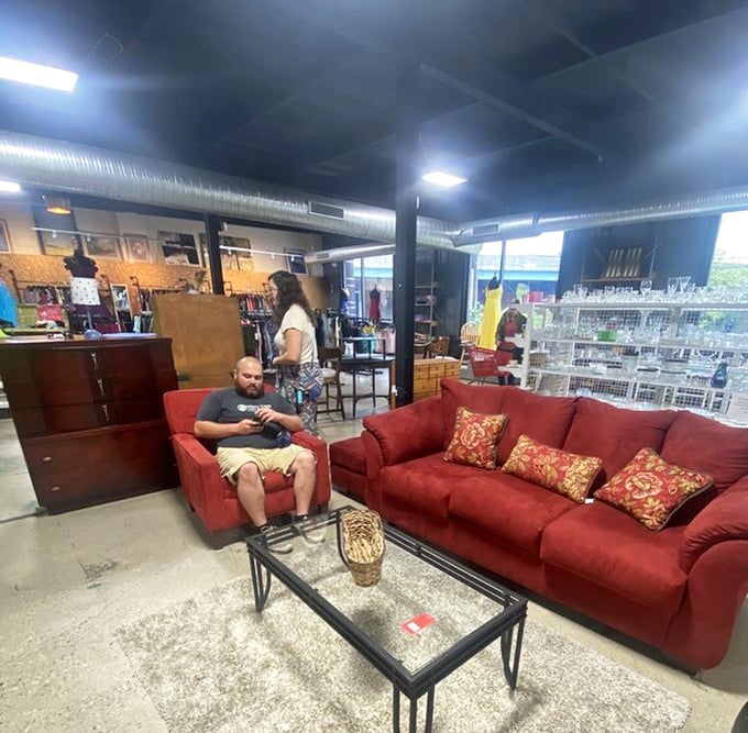 The ultimate "husband chair" situation&mdash;where patient partners test furniture comfort while contemplating life's greatest question: "Are we done shopping yet?"