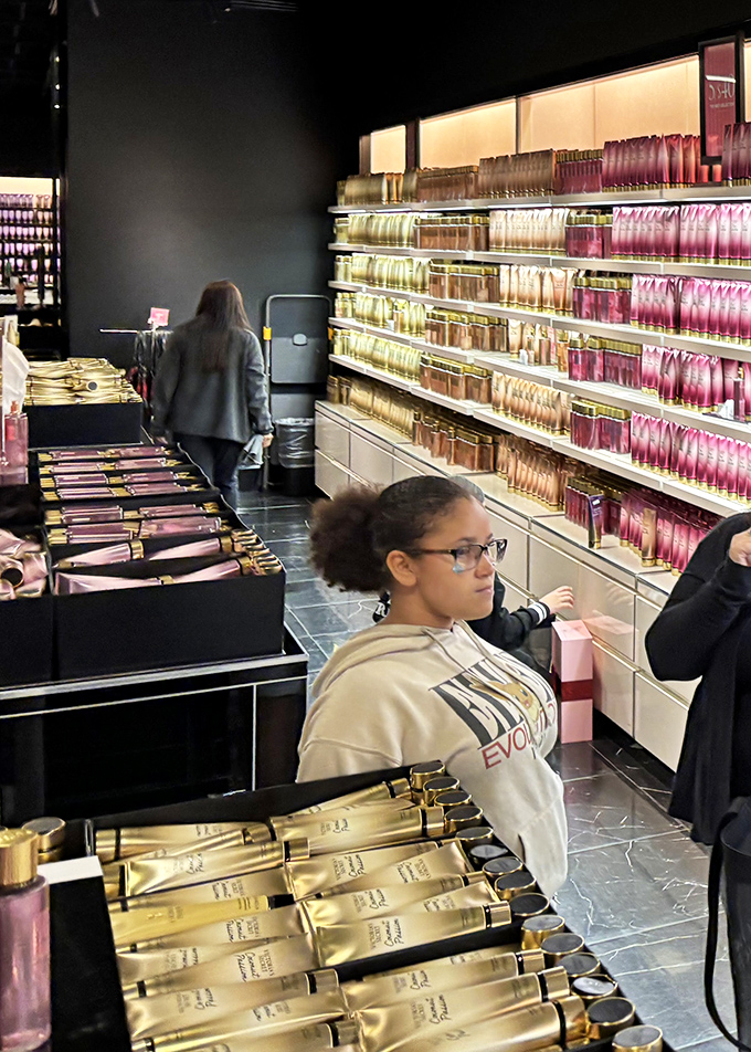 Inside the cosmetics outlet, shoppers hunt for beauty bargains with the focused determination of archaeologists discovering ancient treasures.