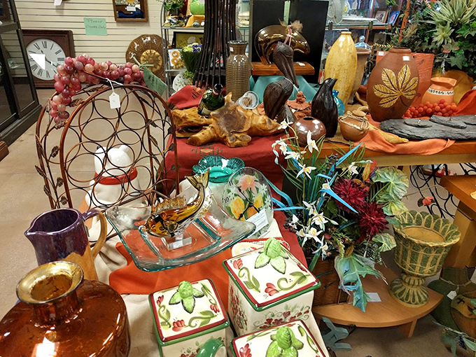 A colorful explosion of home d&eacute;cor treasures arranged with artistic flair. Those ceramic cactus containers are practically screaming "Take me to your bookshelf!"