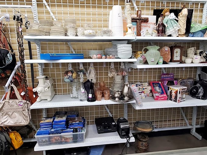 Shelves lined with ceramic curiosities and household items tell stories of dinner parties past, waiting for new tables to grace.