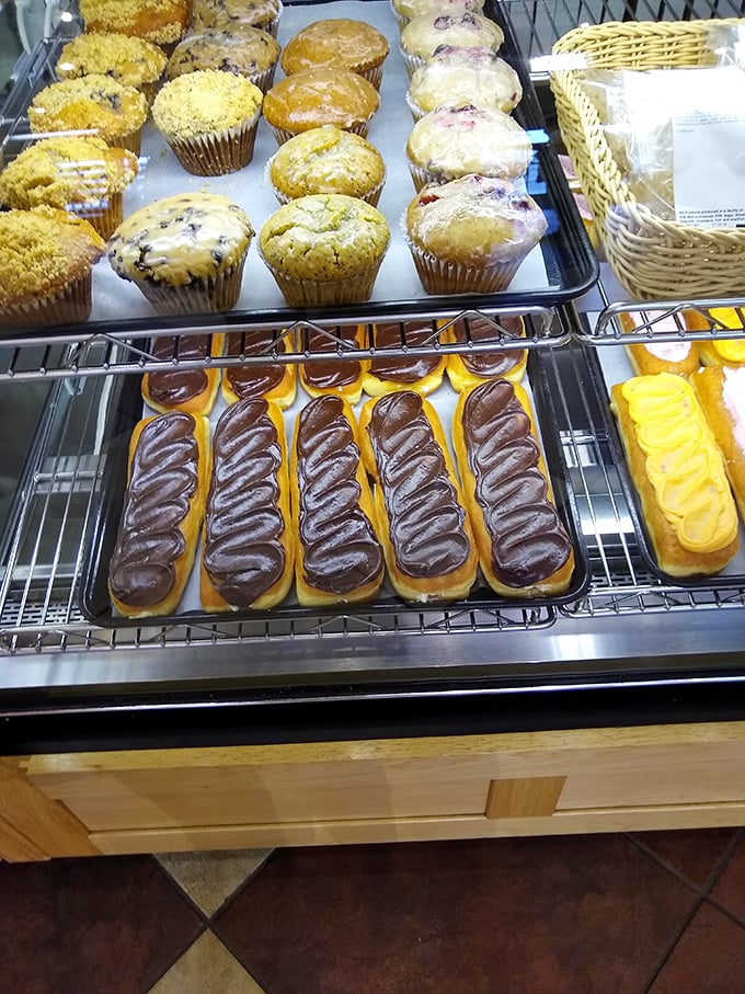 The display case is loaded with fresh, sweet treats! Everything looks so moist, fluffy, and ready to be enjoyed.