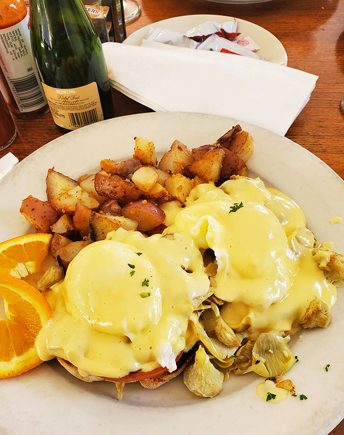 Eggs Benedict that makes you question why you ever attempted to make hollandaise at home. Those potatoes deserve their own fan club.