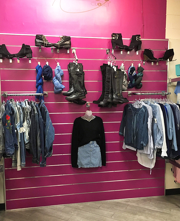 The pink wall of possibilities! Boots that once walked Fifth Avenue now await Nevada adventures, while denim jackets promise second chances at first impressions.