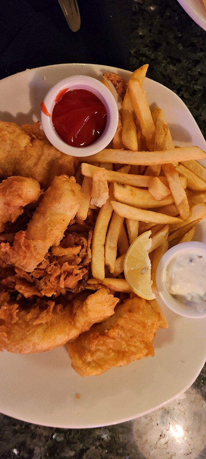 Comfort food gets the seafood treatment &ndash; golden-battered fish alongside crispy fries. The kind of plate that makes diets wave the white flag of surrender.