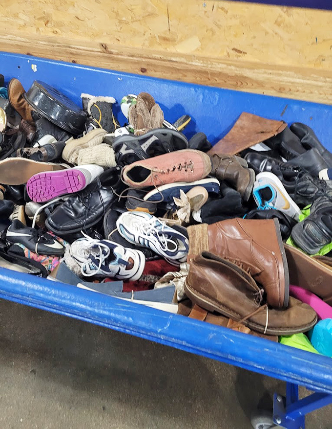 The footwear bin: where lone wolves find their mates and vintage boots get second chances. A leather landscape of possibility awaits the patient hunter.