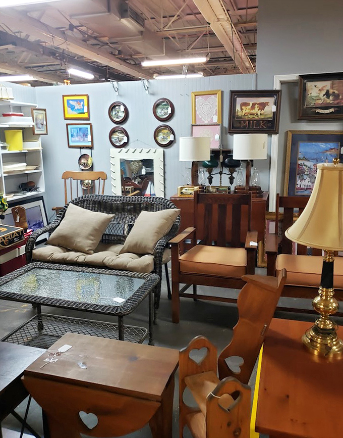 Mid-century meets country charm in this furniture display. That wicker coffee table has hosted more interesting conversations than most social media platforms.