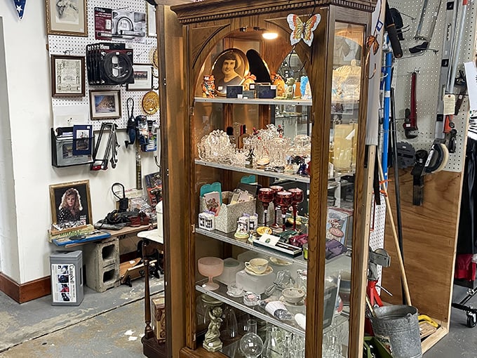 A wooden curio cabinet stands sentinel, guarding treasures from another era&mdash;from delicate porcelain to vintage photographs that tell stories we can only imagine.
