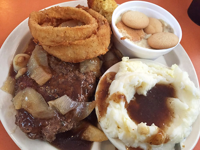 Hamburger steak with mashed potatoes and onion rings proves that some plates deserve their own fan clubs and appreciation societies.