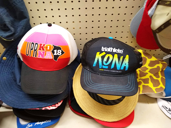 Ironman Kona caps mingle with vacation headwear&mdash;each hat a souvenir of someone else's adventure, now ready to join yours for a fraction of the original price.