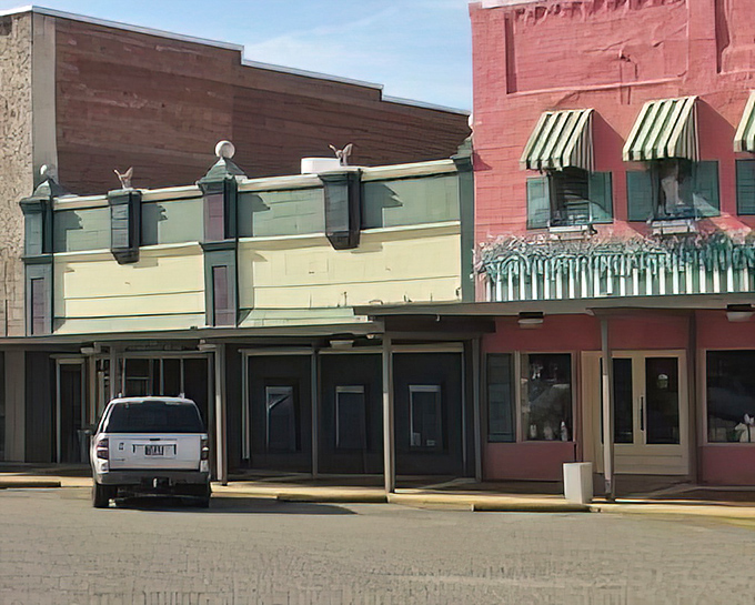 Pastel-colored storefronts stand shoulder to shoulder like old friends who've weathered decades of economic storms together.