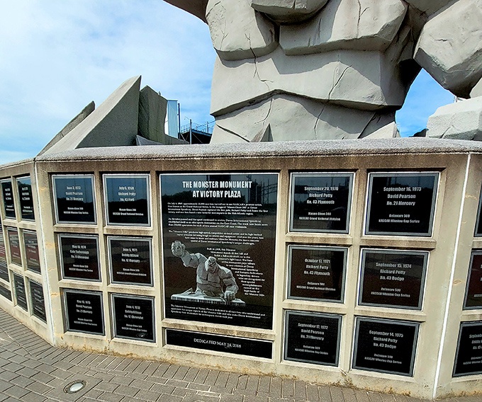 The Monster Monument's base tells racing stories through commemorative plaques, a concrete history book for speed enthusiasts.