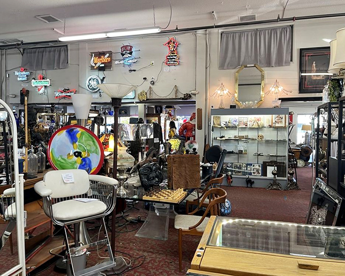 Neon signs illuminate a treasure trove of mid-century furniture, where every chair has a story and every table has hosted countless conversations.