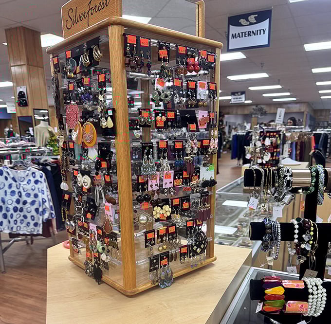 The "Silver Forest" jewelry display transforms costume pieces into treasure hunt finds for eagle-eyed shoppers.