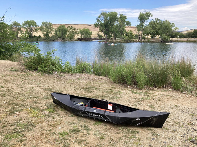 A lonely kayak waits patiently for adventure, because sometimes the best therapy floats and requires a paddle.